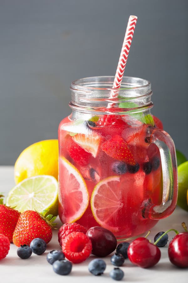 Summer Berry Lemonade with Lime and Mint in Mason Jar Stock Image ...