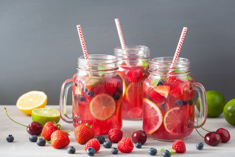 Summer Berry Lemonade with Lime and Mint in Mason Jar Stock Photo ...
