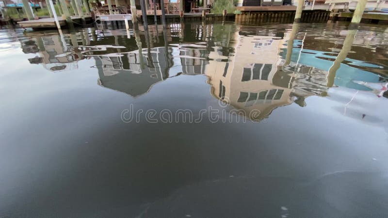 Summer Boat View of a Waterfront Home with Its Rippling Reflection on ...