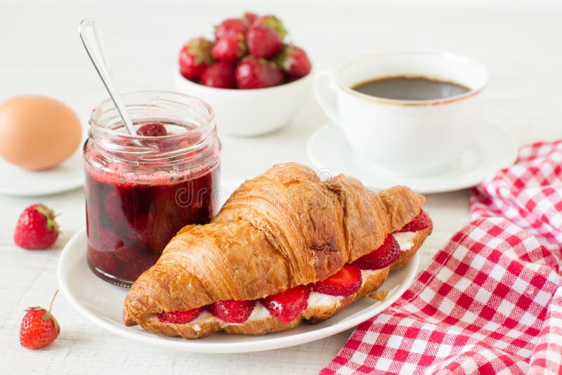 Breakfast with Coffee, Croissant and Strawberry Jam on a Table Stock ...