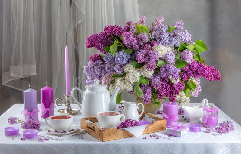 Summer Breakfast Concept. Tea in Cups and Lilacs on the Table Stock ...