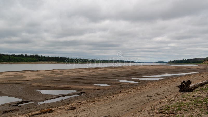 The Peace River is Seen Under Heavy Summer Clouds at Peace Point in ...