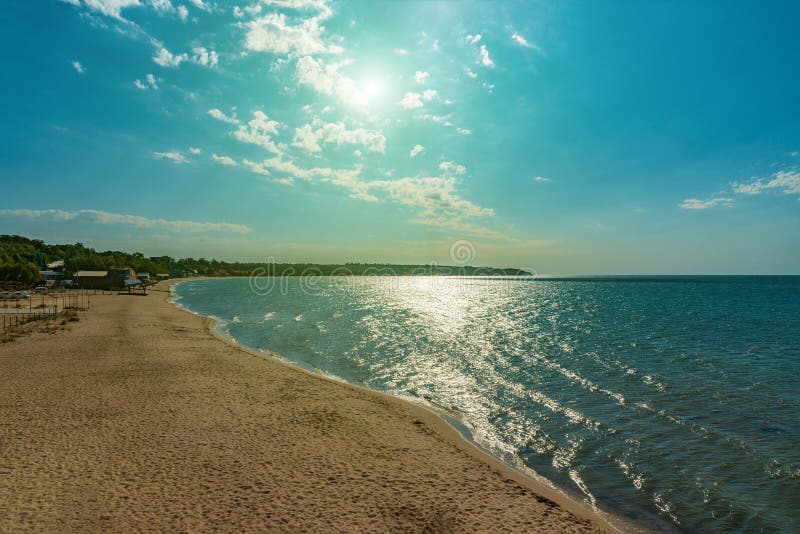 Summer Deserted Beach at Sea, Side View with the Sun from Above. Stock ...