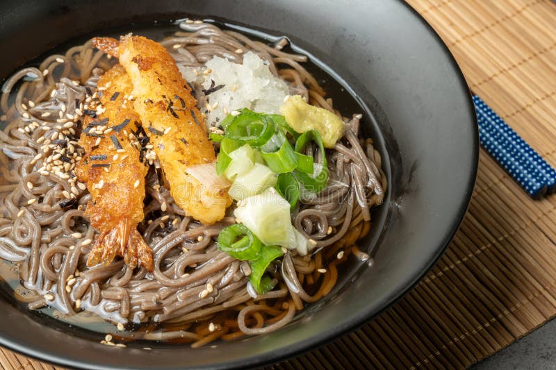 A Summer Dish of Cold Wheat Noodles with Fried Shrimp in a Black Bowl ...