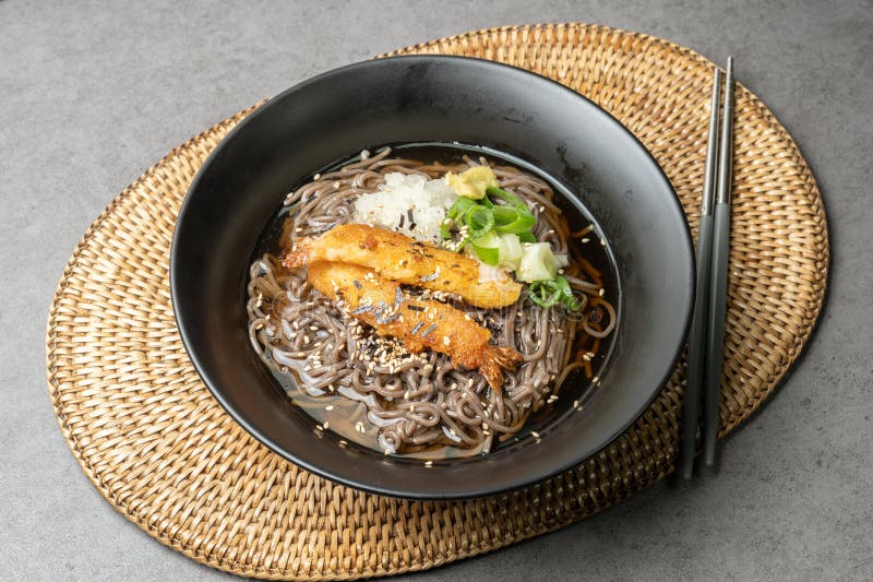 A Summer Dish of Cold Wheat Noodles with Fried Shrimp in a Black Bowl ...