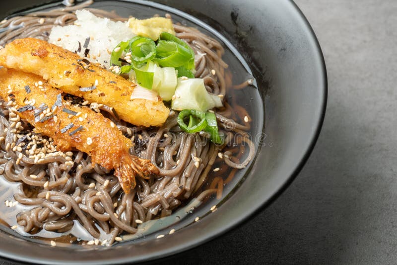 A Summer Dish of Cold Wheat Noodles with Fried Shrimp in a Black Bowl ...