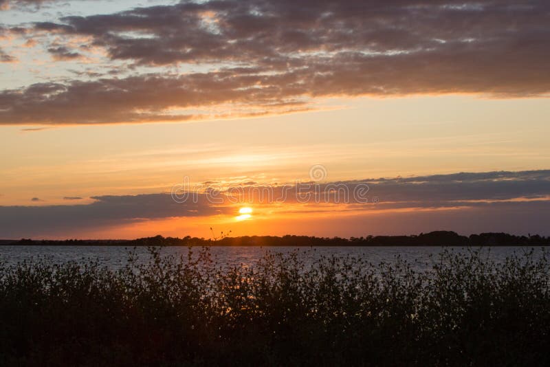 Summer Sunset East Coast Bay Stock Image - Image of silhouette, coastal ...