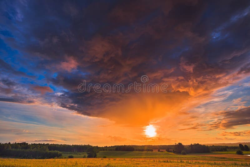 Summer Field at Sunset with Dramatic Clouds Stock Photo - Image of ...