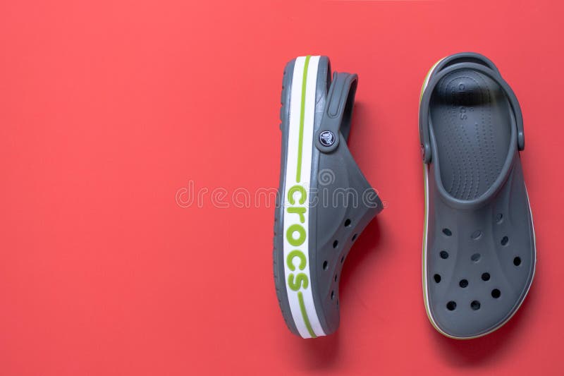 Summer Flip-flops on Red Background. Crocs Soft Gray Rubber Sandals ...