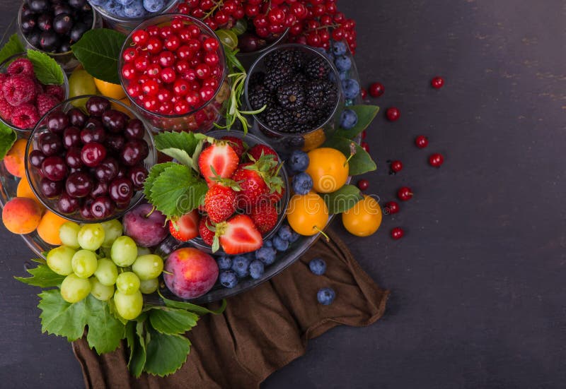 Summer Fresh Berries of Different Types on a Black Background Stock ...