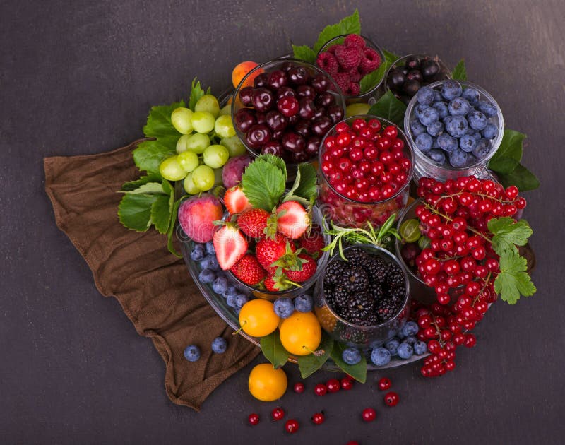 Summer Fresh Berries of Different Types on a Black Background Stock ...