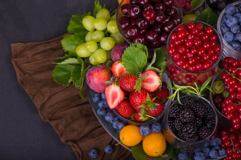 Summer Fresh Berries of Different Types on a Black Background Stock ...
