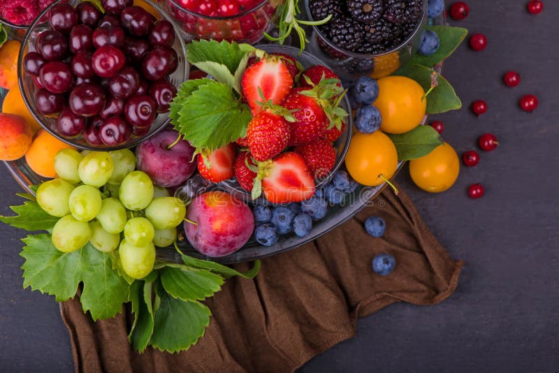 Summer Fresh Berries of Different Types on a Black Background Stock ...