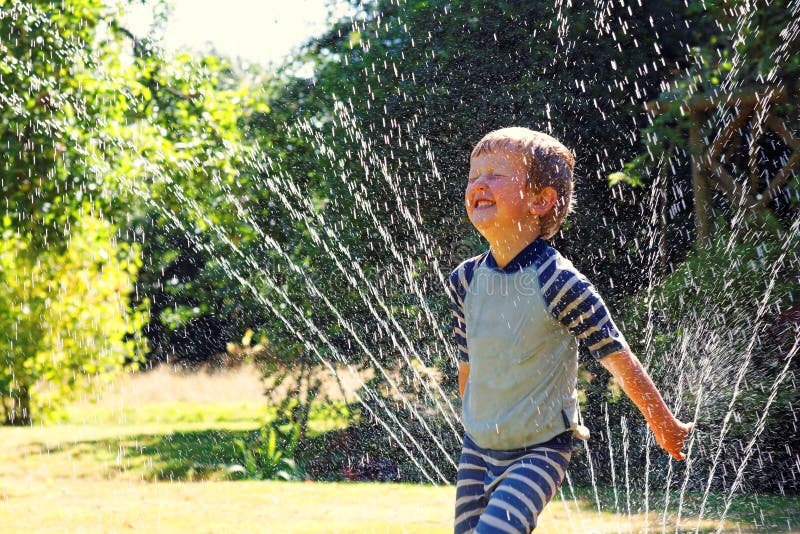 Summer Fun with Water Sprinkler Stock Image - Image of season, summer ...