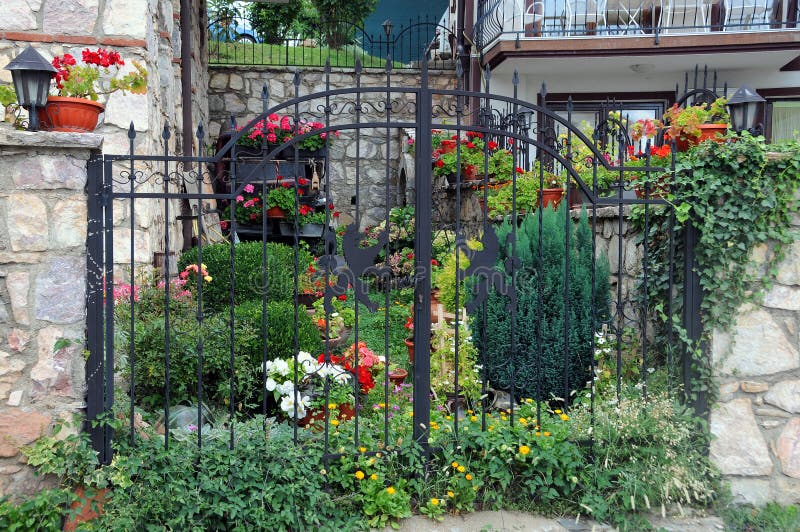 Summer Garden Behind the Gate Stock Photo - Image of colourful, potted ...