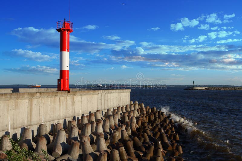 The Lighthouse on the Pier and Breakwaters Stock Photo - Image of ...