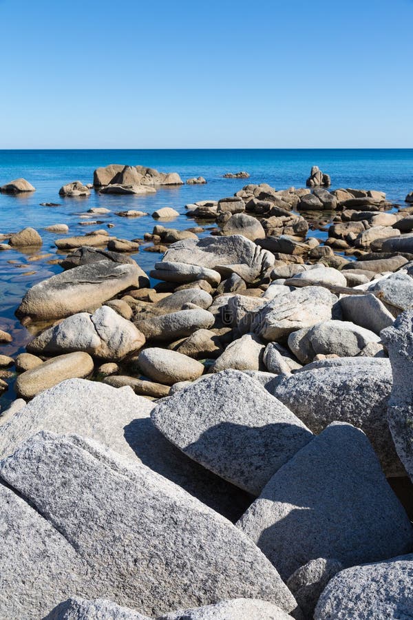 Pebble beach stock image. Image of shore, landscape, mountain - 12930455