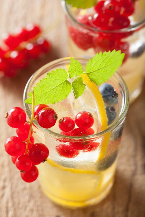 Summer Lemonade with Berry and Lemon Stock Photo - Image of rustic ...
