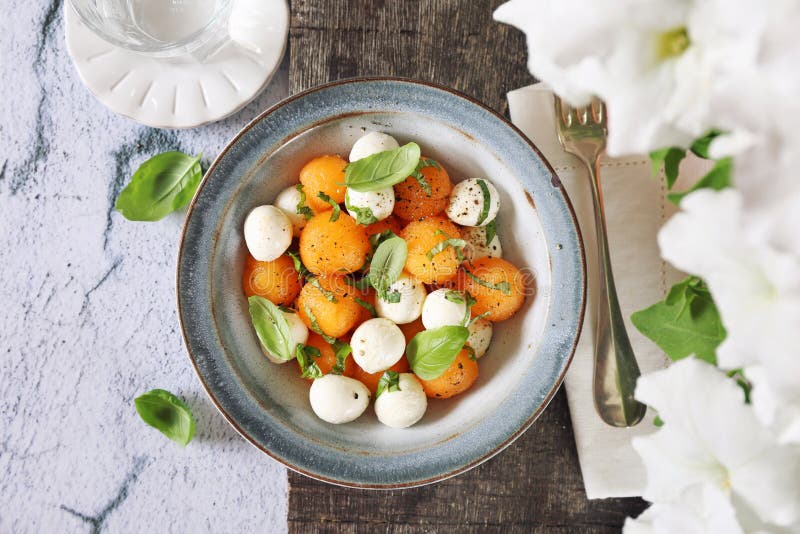 Summer Light Food. Mozzarella and Melon Salad with Basil Stock Image ...