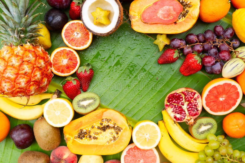 Summer Mix of Tropical Fruits Over Green Leaf Stock Photo - Image of ...