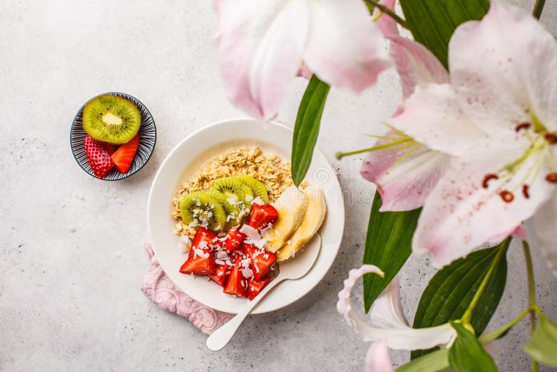 Summer Oatmeal with Fruit and Coconut in a White Plate Stock Image ...