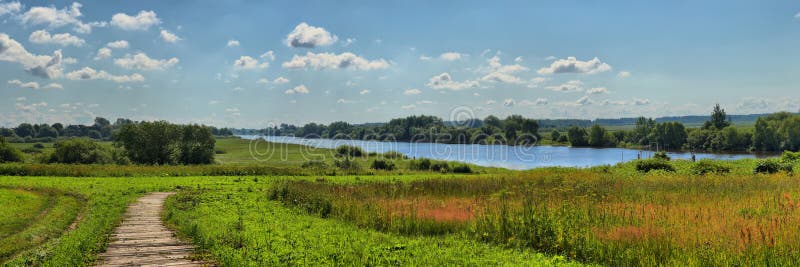Summer Panorama with a River and a Wooden Path Stock Photo - Image of ...