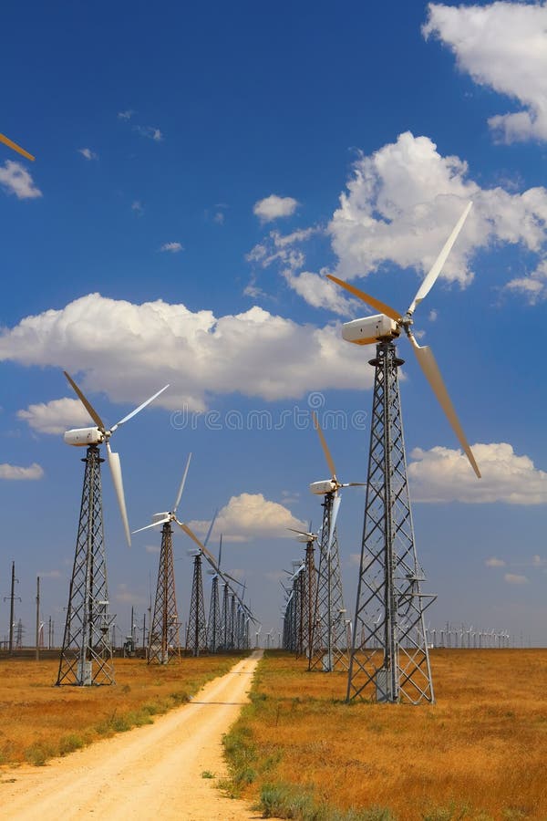 Field With Windmills For Electric Power. Clean Energy Produced By The ...