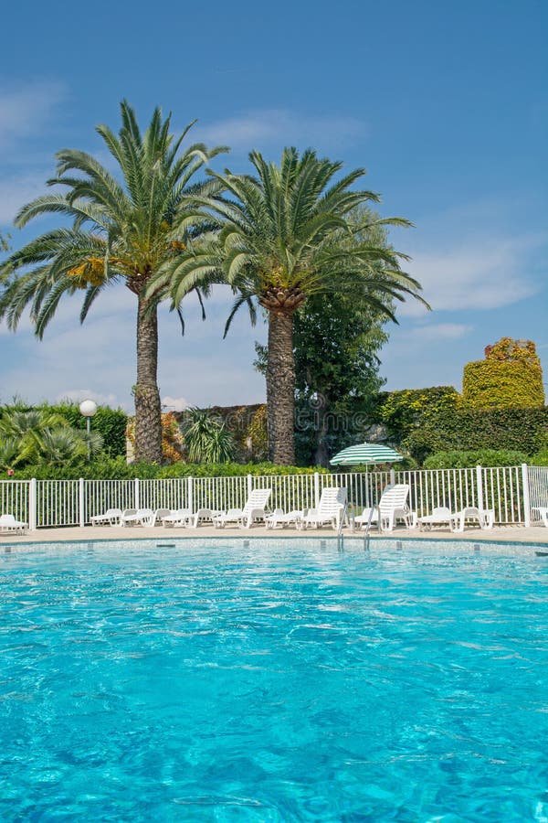 Summer pool stock image. Image of view, umbrellas, sunbed - 44499421