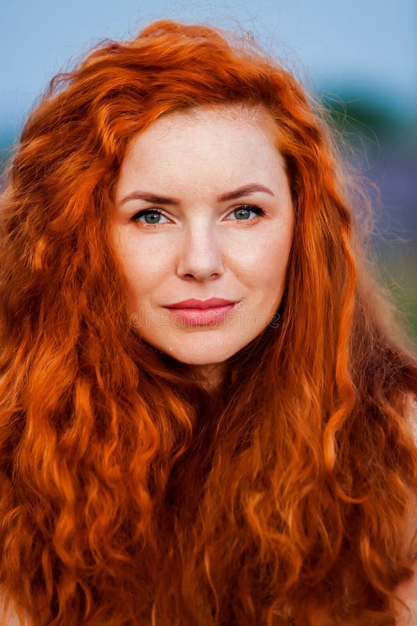 Summer Portrait Of A Beautiful Girl With Long Curly Red Hair Stock