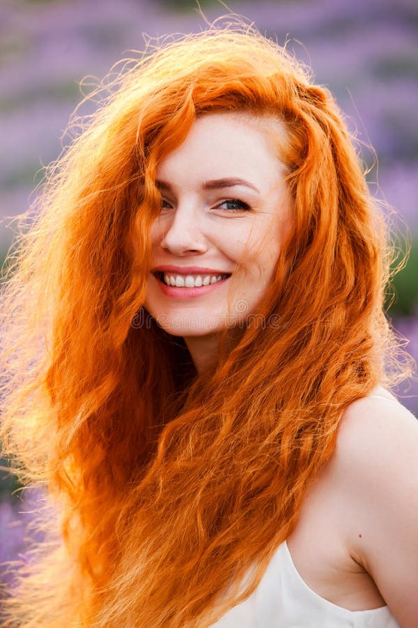 Summer Portrait Of A Beautiful Girl With Long Curly Red Hair Stock