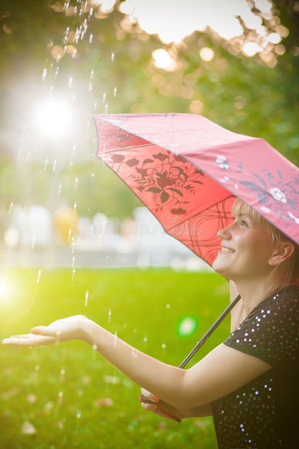 Summer Rain in the Sunset Holding a Woman Stock Photo - Image of asian ...