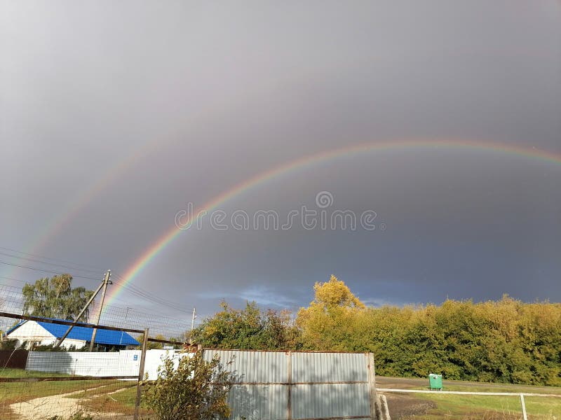 Summer rainbow Village stock photo. Image of dusk, sunlight - 253174954