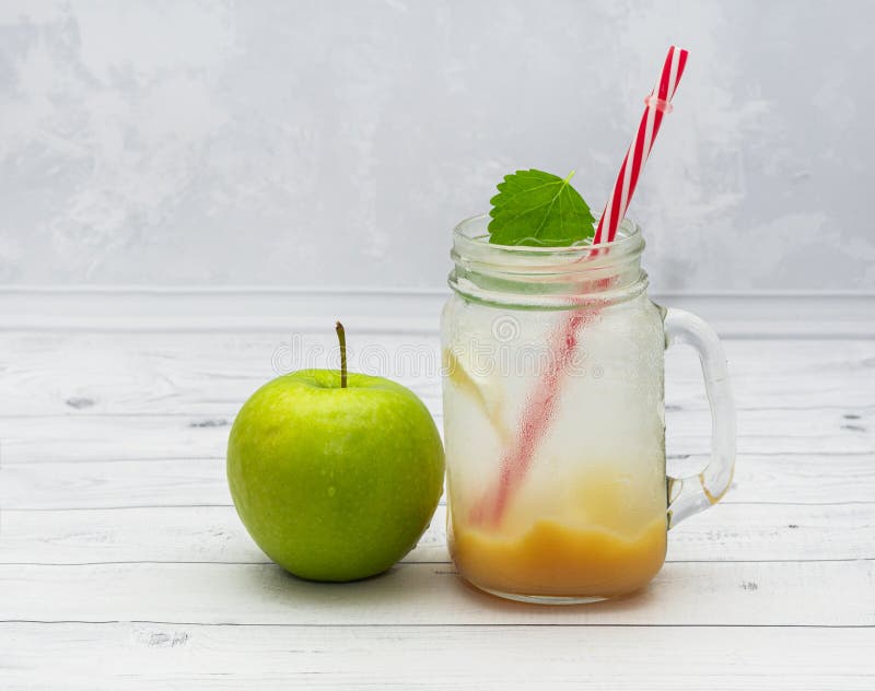 Summer Refreshing Apple Drink with Ice in a Misted Glass Mug Stock ...