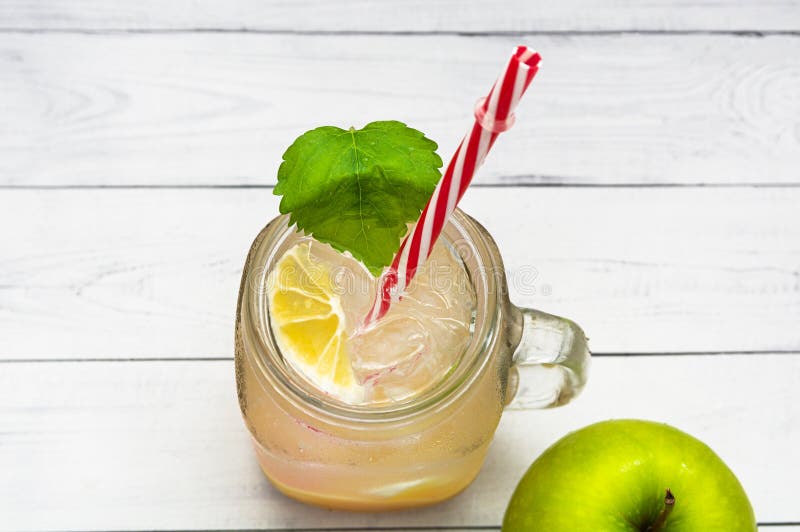 Summer Refreshing Apple Drink with Ice in a Misted Glass Mug Stock ...