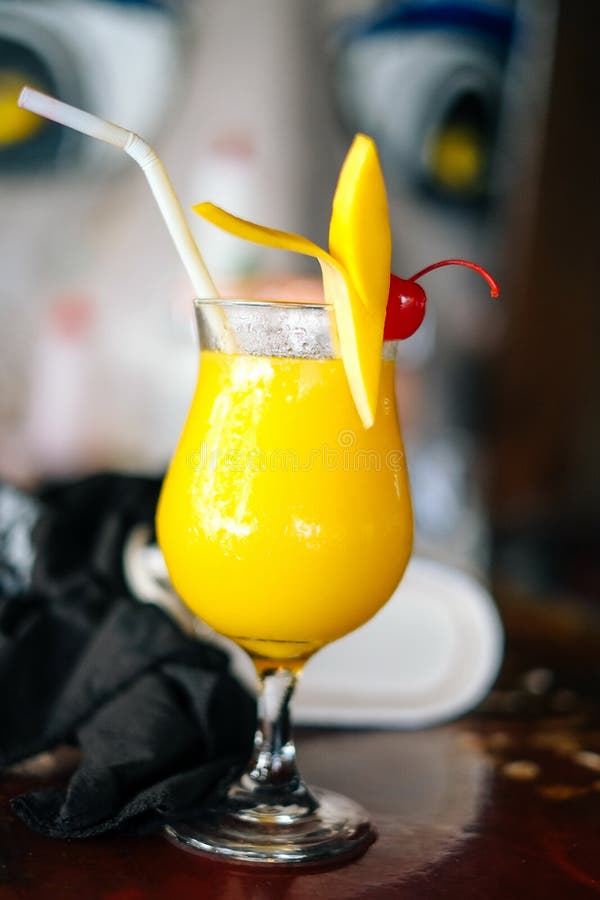 Summer Refreshment Drink Mango Shake with Cherry in the Glass Stock ...