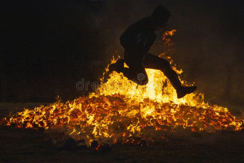 Summer Solstice Celebration Jumping into the Fire. Burning Flames Stock ...