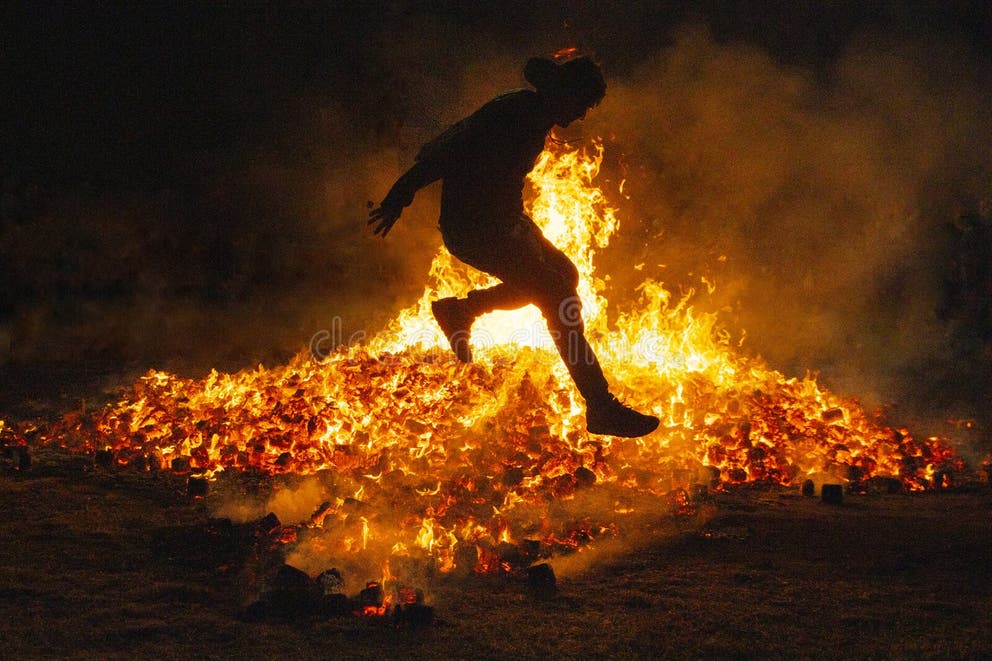 Summer Solstice Celebration Jumping into the Fire. Burning Flames ...