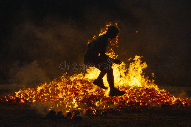 Summer Solstice Celebration Jumping into the Fire. Burning Flames Stock ...