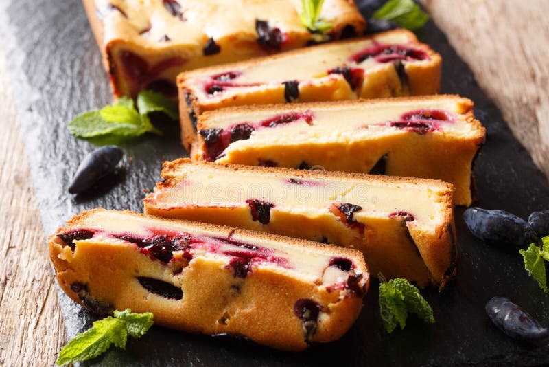Summer Sponge Cake with Honeysuckle and Mint on the Board Closeup ...