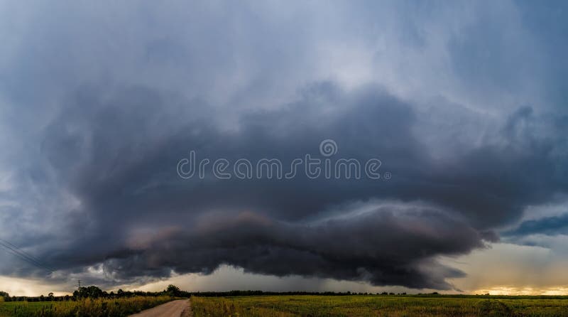 Summer Storm Cloud Hovering Over Farm Field Stock Photo - Image of blue ...
