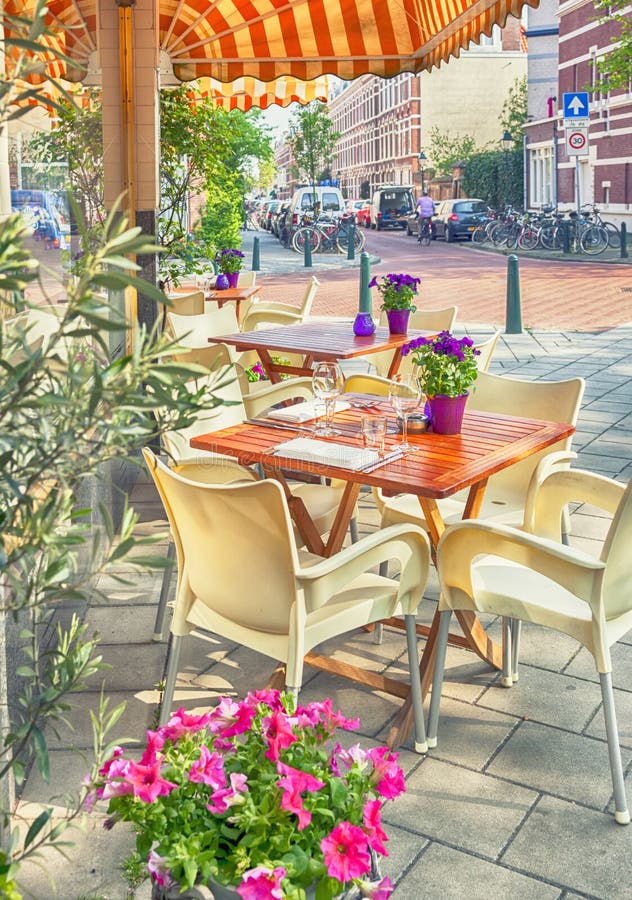 Cafe Table with Flowers. Focus on Flowers Stock Image - Image of ...