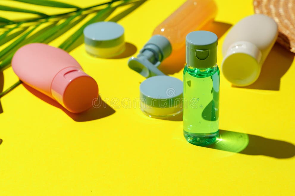 Summer Sun Protection Essentials on Yellow Background Stock Image ...