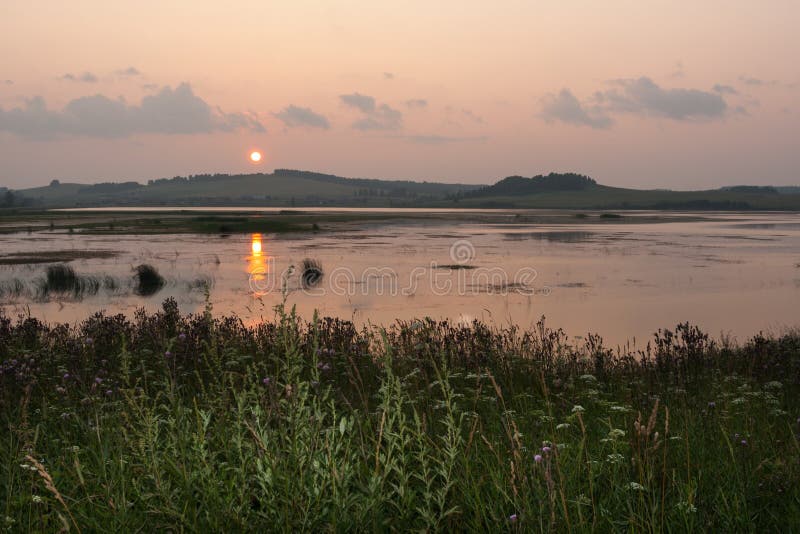 Summer Sunset Over Pond and Small Village Behind Him. Stock Image ...