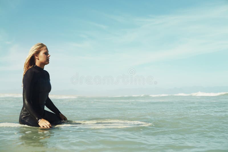 Summer is for Surfing. an Attractive Young Woman Surfing at the Beach ...