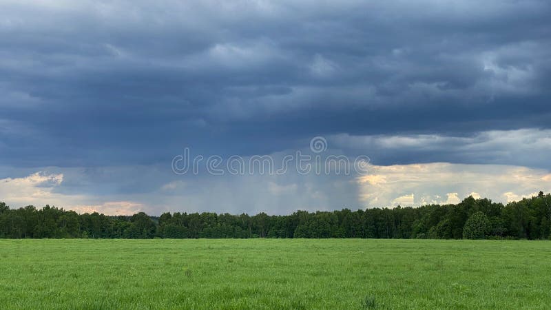 Summer Thunderstorm. Stormy Dramatic Sky and Green Field Stock Photo ...