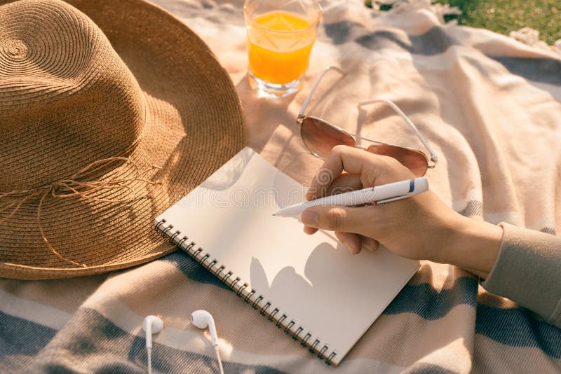 Summer Time - Hands with Pen Writing on Notebook in the Park Stock ...