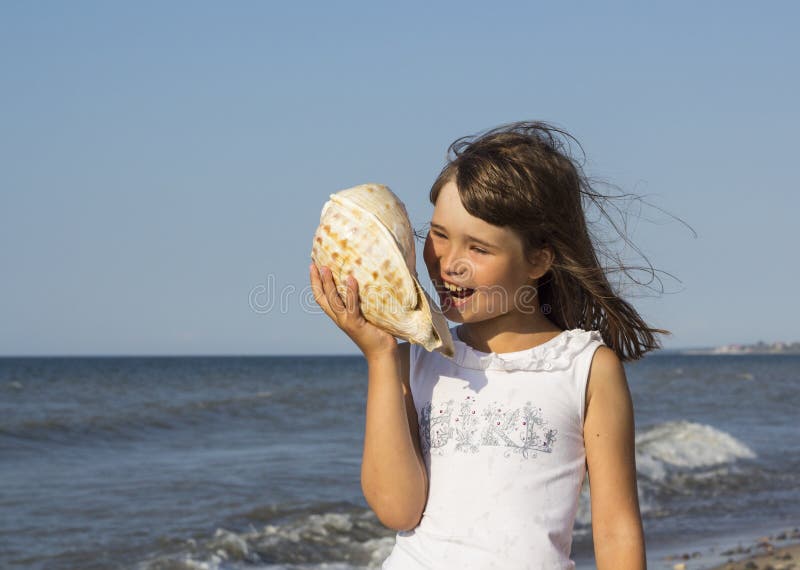 Summer Vacation - Beautiful Girl With Shell At The Beach Stock Image ...
