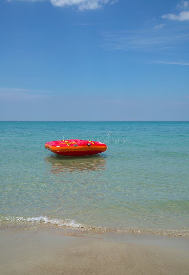 Inflatable Ring or Lilo in the Sea by the Beach Stock Photo - Image of ...