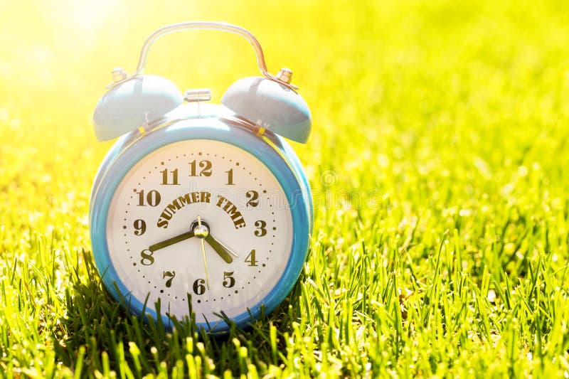 Summer Vacation Time - Alarm Clock in Green Grass Stock Image - Image ...
