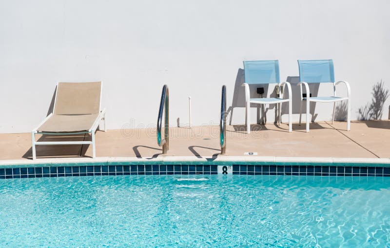Summertime Poolside with Sunbed at Blue Pool Water Stock Image - Image ...